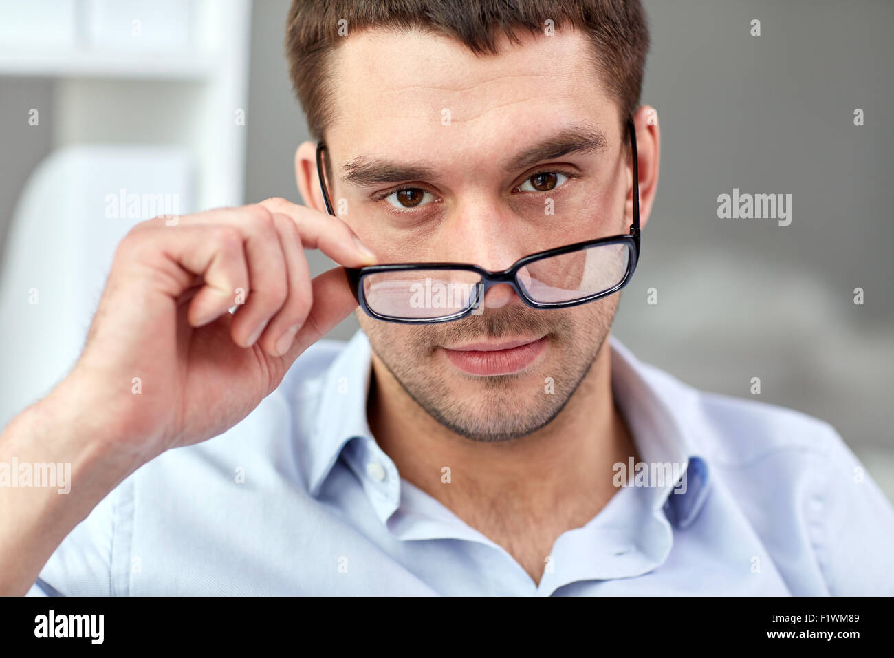 portrait of businessman in eyeglasses at office Stock Photo - Alamy