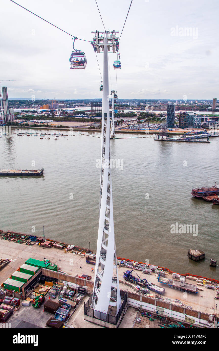 Emirates Air Line cable cars ride across the River Thames from North ...