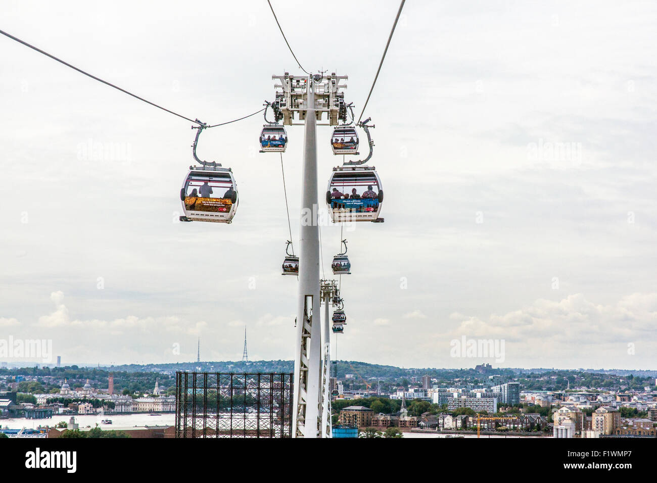 Emirates Air Line cable cars ride across the River Thames from North ...