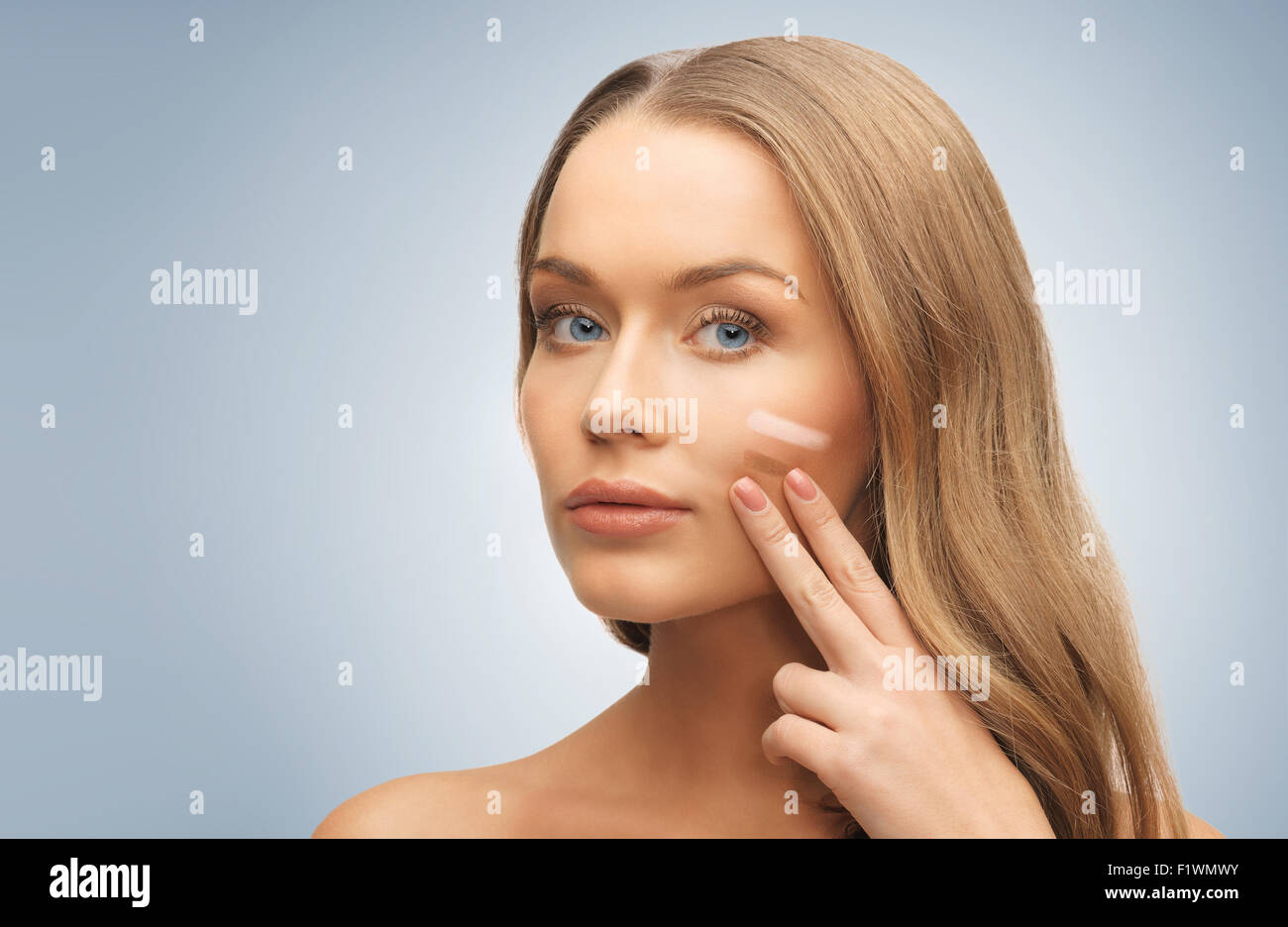woman with pale and dark foundation tone on face Stock Photo - Alamy