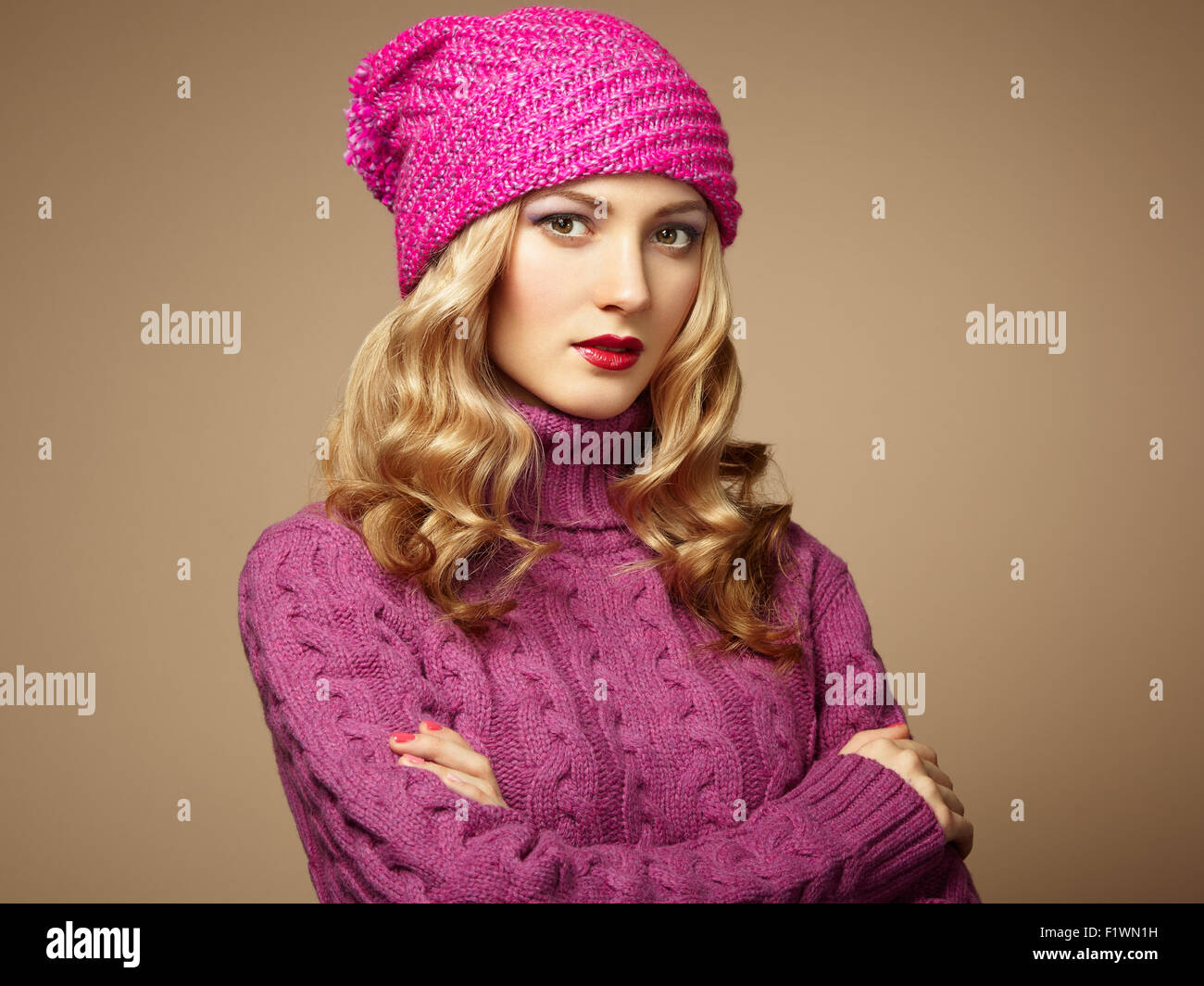 Fashion photo of beautiful woman in sweater. Curly hairstyle. Make-up ...