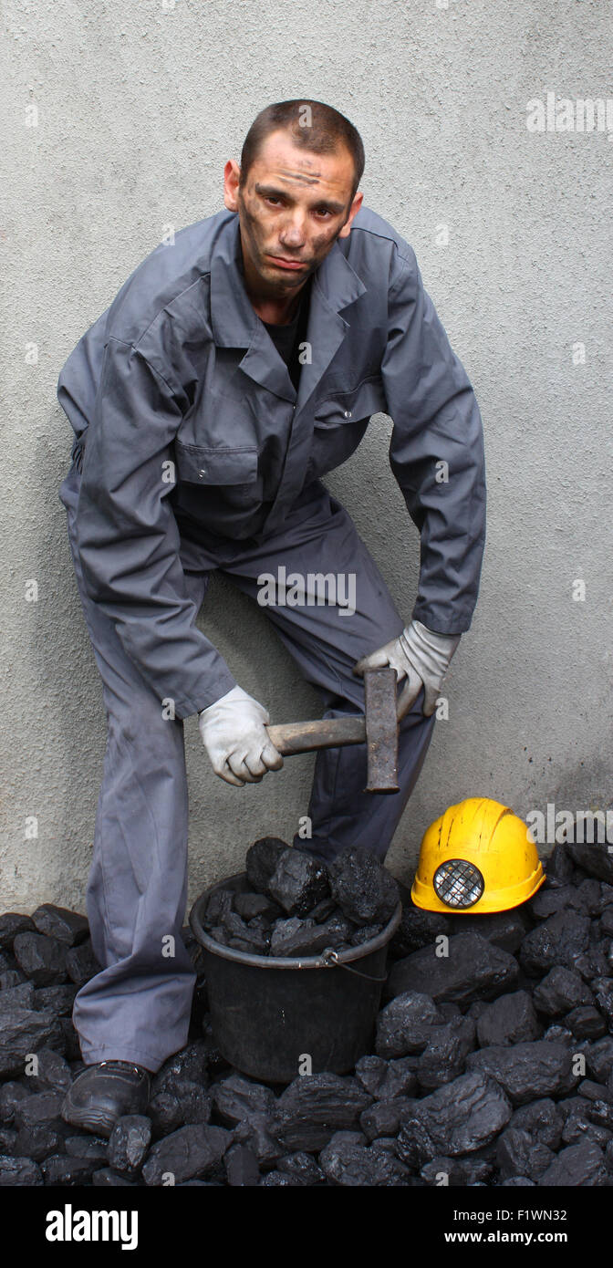 Portrait of a miner while working in a coal mine Stock Photo - Alamy