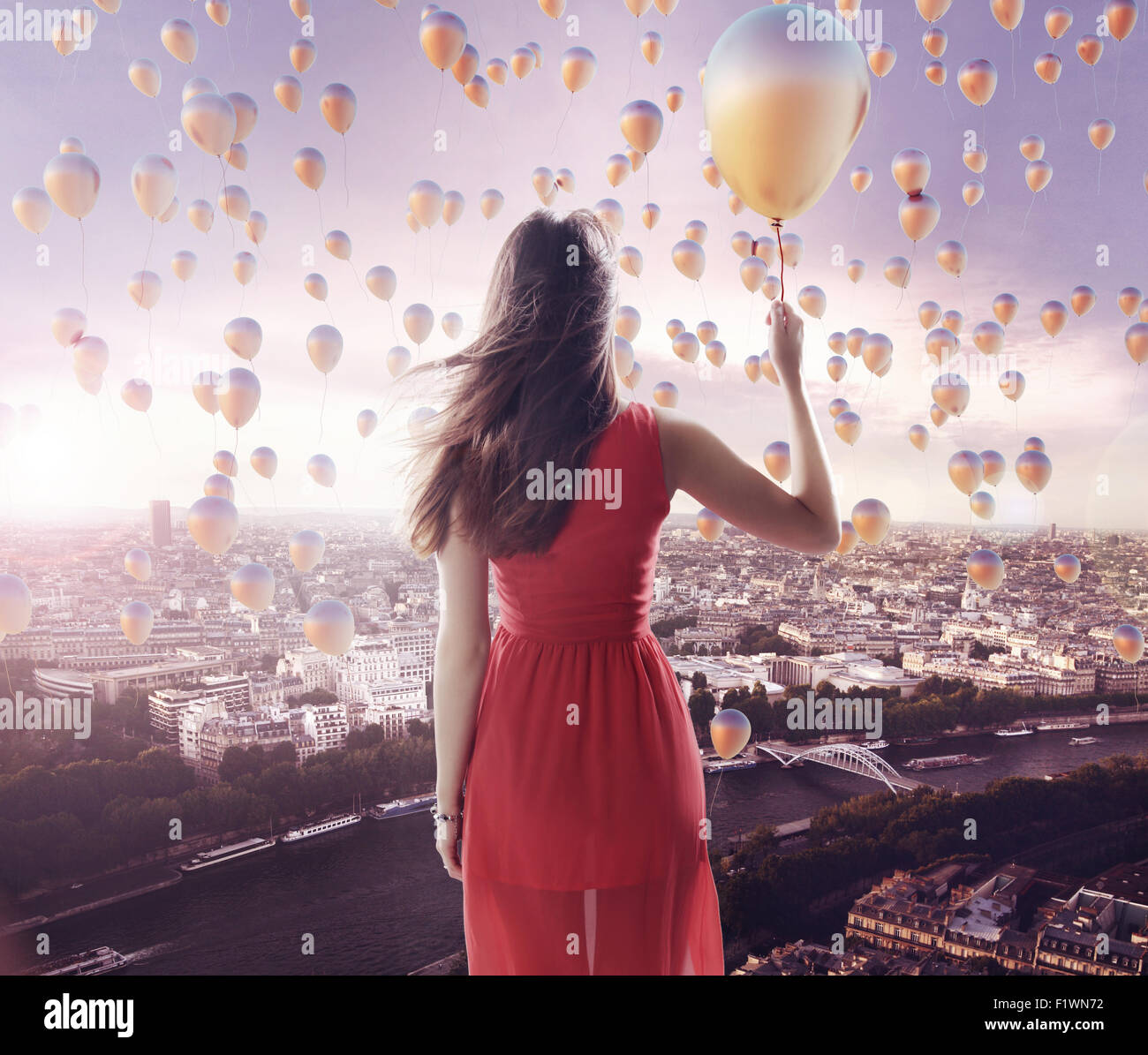 Young lady and the city of the tiny balloons Stock Photo - Alamy