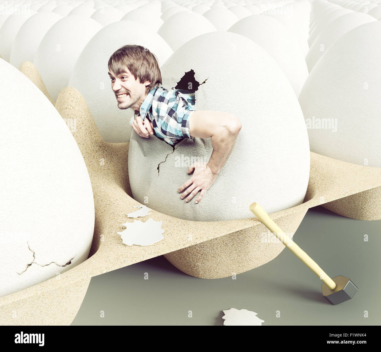 Man hit shell, getting out of eggs. Creative concept Stock Photo - Alamy