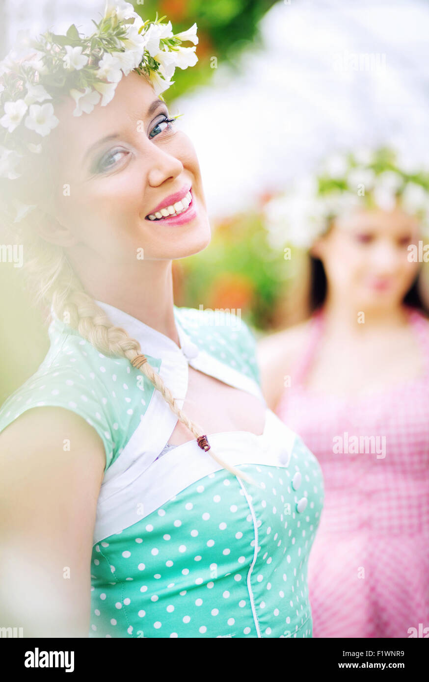 Two marvelous flower nymphs in blooming garden Stock Photo - Alamy