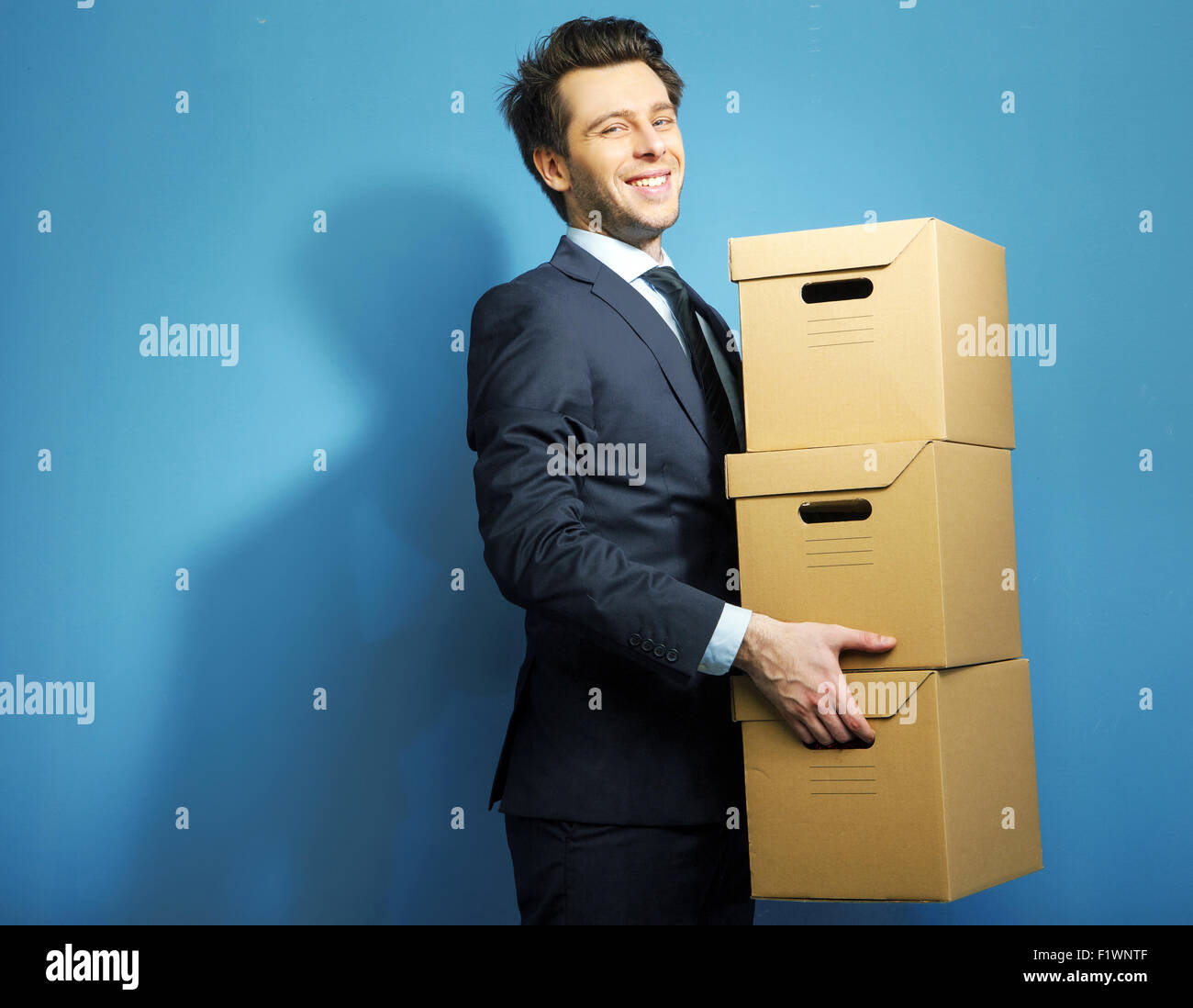 Successful gentleman with the paper boxes Stock Photo - Alamy