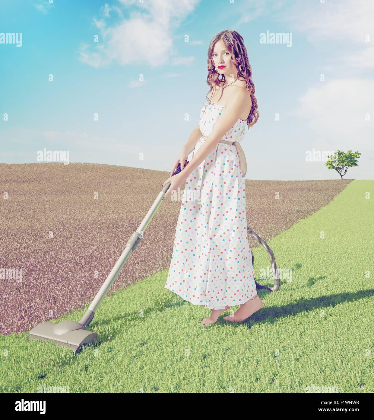 Young woman cleaning natural green grass in wild landscape. Creative ...