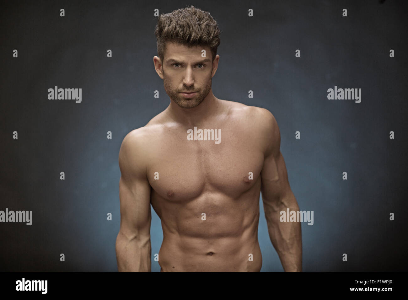 Handsome muscular man with great hairstyle Stock Photo - Alamy