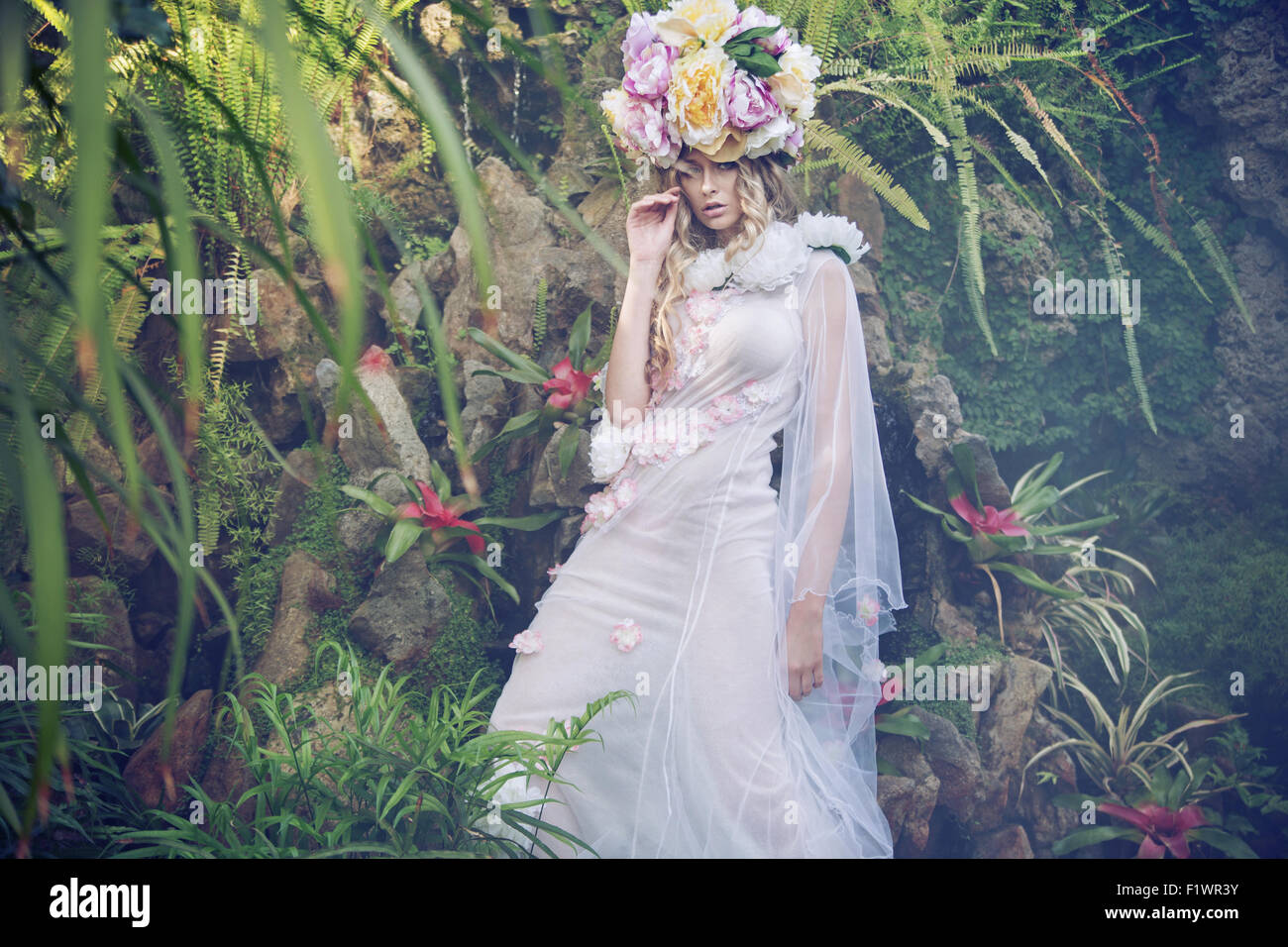 Pretty young lady wearing fancy colorful hat Stock Photo - Alamy