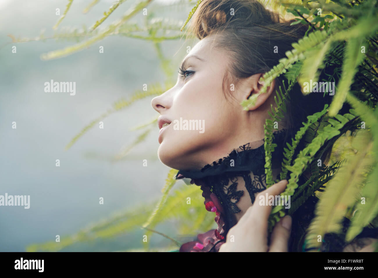 Brunette lady in the tropical forest Stock Photo - Alamy