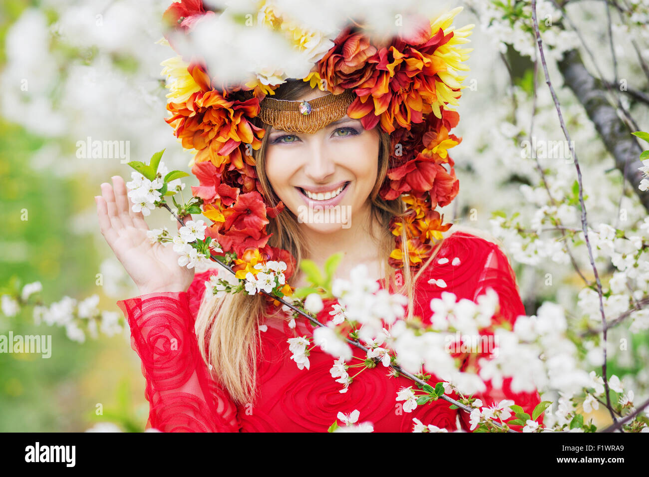 Beautiful lady with the colorful flowery hat Stock Photo - Alamy