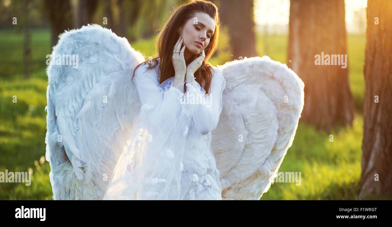 Realxed angel heated by the sun beams Stock Photo - Alamy