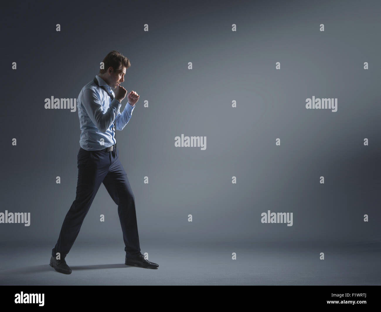 Tired businessman during fight for success Stock Photo - Alamy