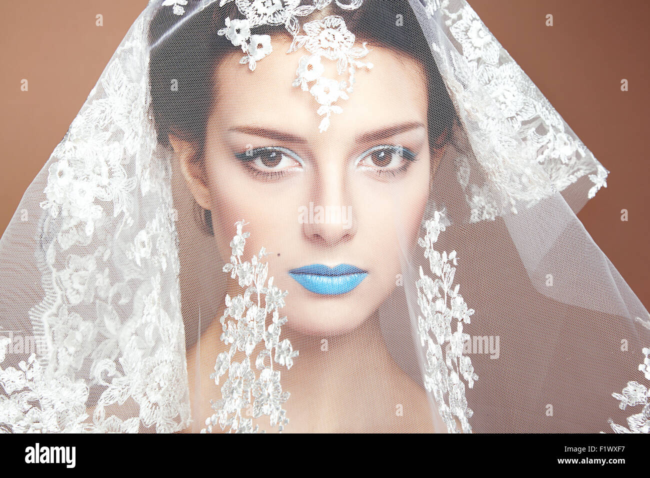Fashion photo of beautiful women under white veil. Beauty portrait ...