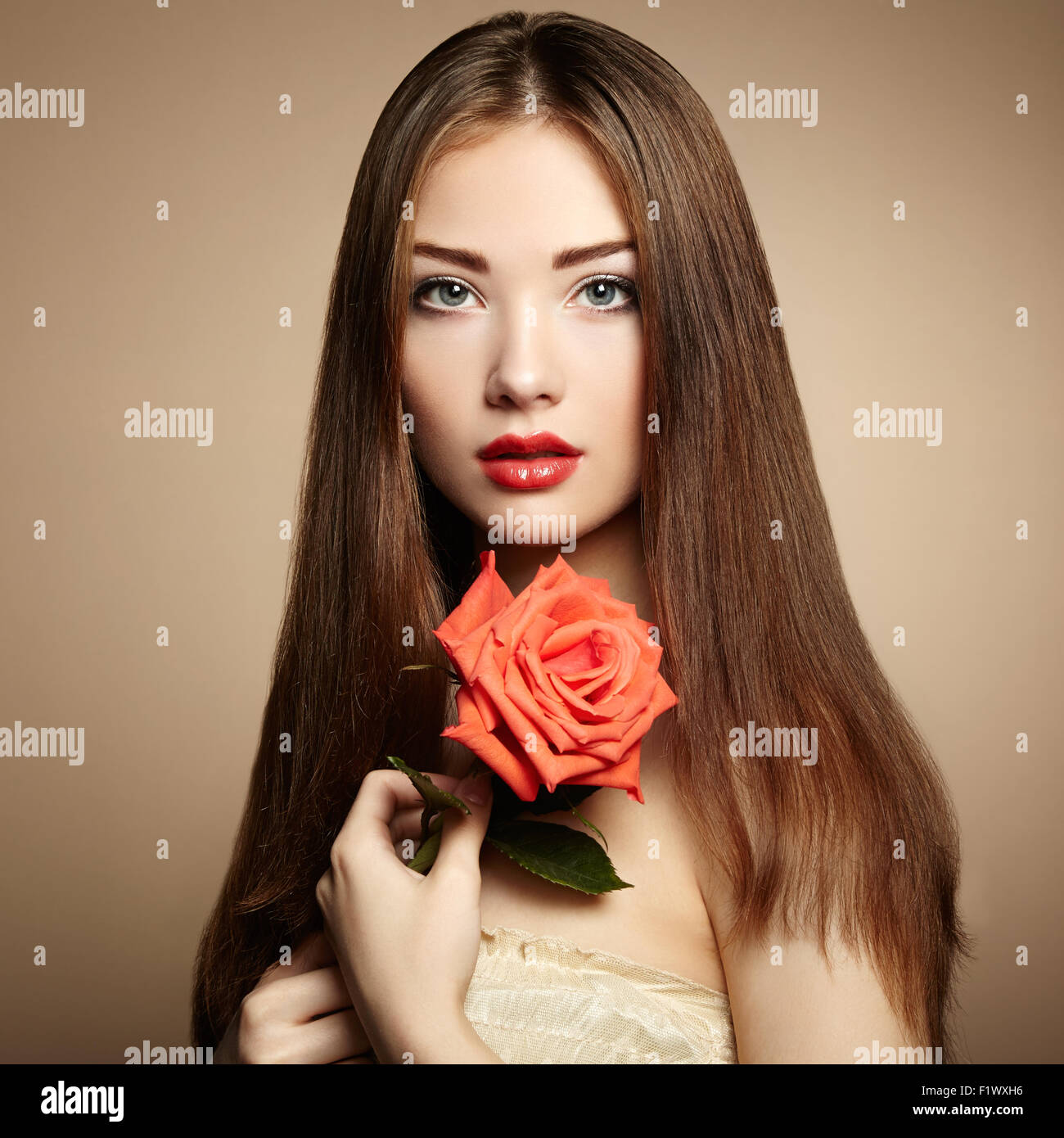Portrait of beautiful dark-haired woman with flowers. Fashion photo ...