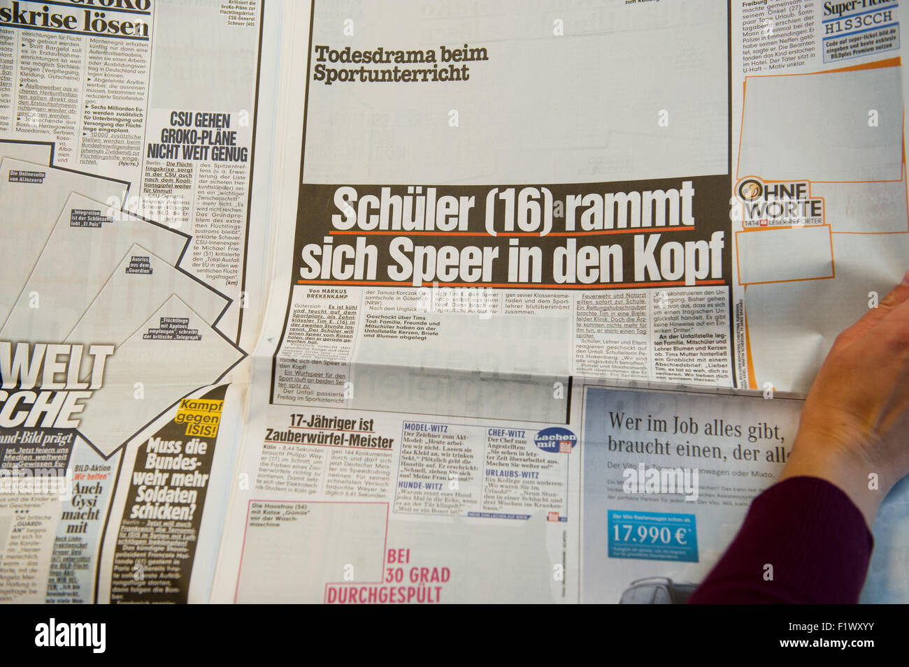 A young woman holds the latest edition of Germany's best-selling ...