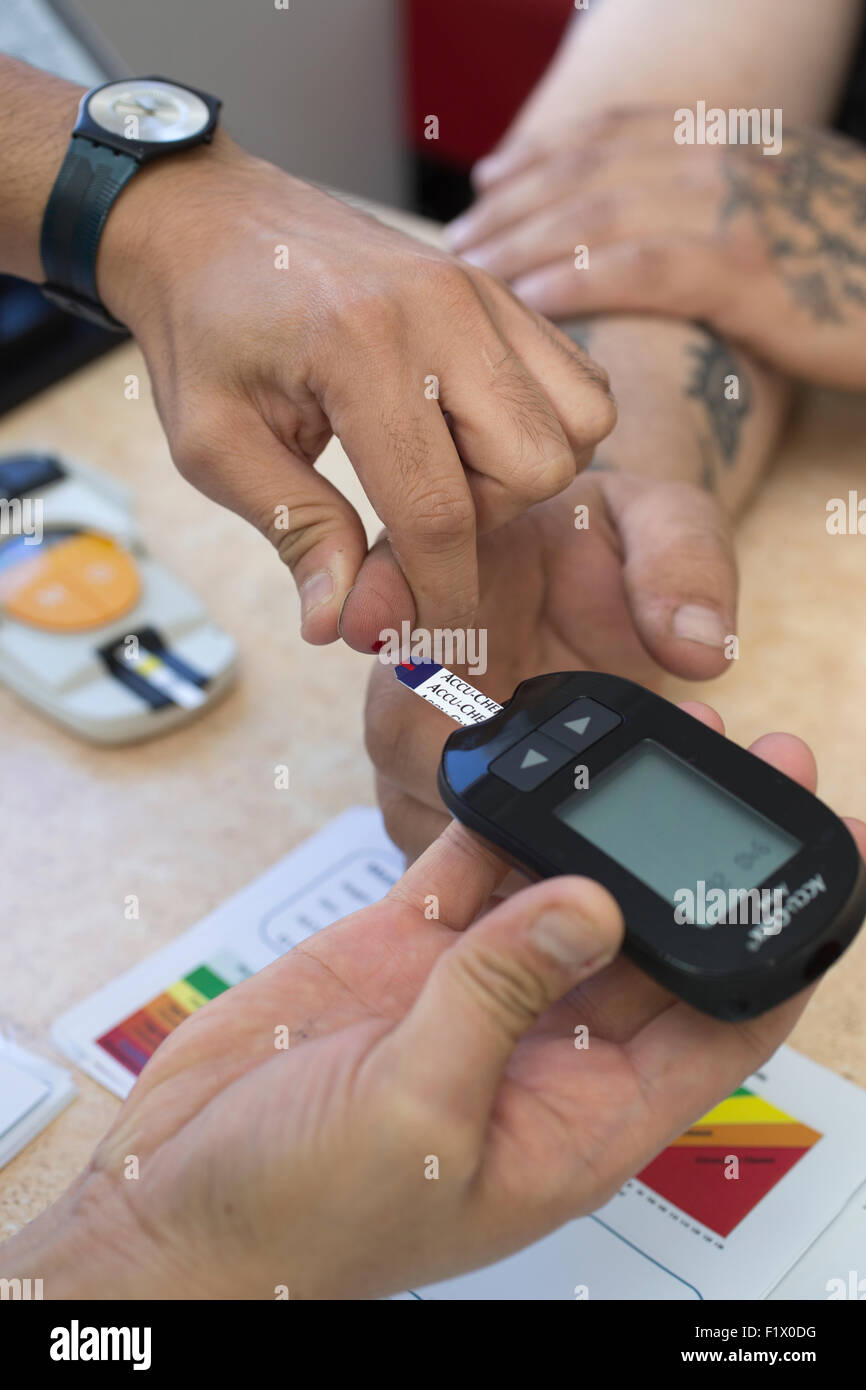 Construction Workers Taking A Diabetes Test And General Health Check On Site England UK Stock construction-workers-taking-a-diabetes-test-and-general-health-check-on-site-england-uk-stock
