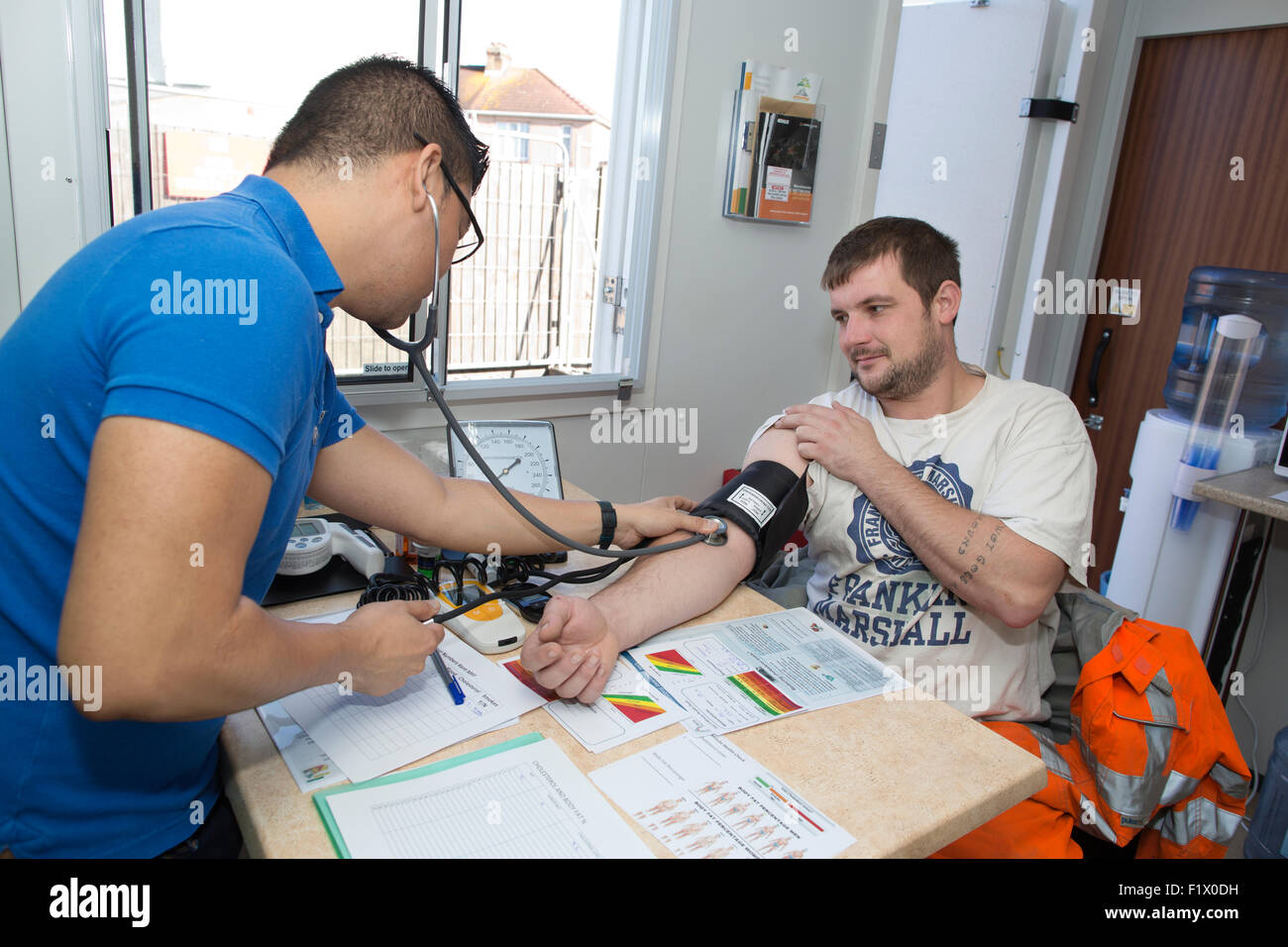 Construction workers taking Blood Pressure Test and general health ...