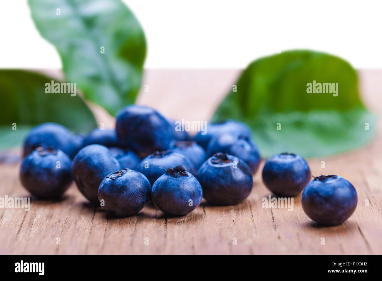 natural fresh blueberries closeup on wooden background Stock Photo - Alamy