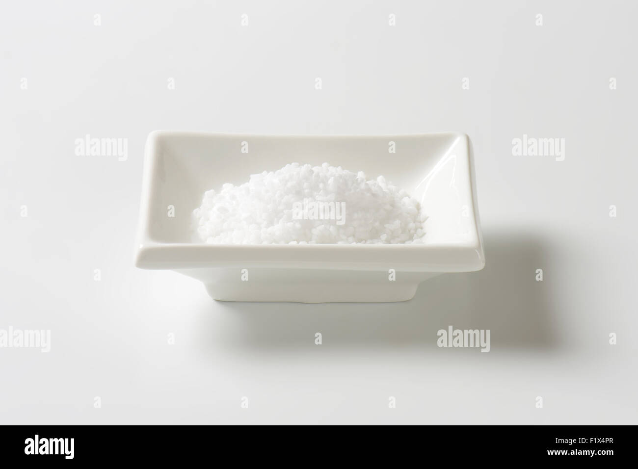 coarse ground salt in white rectangular bowl Stock Photo - Alamy