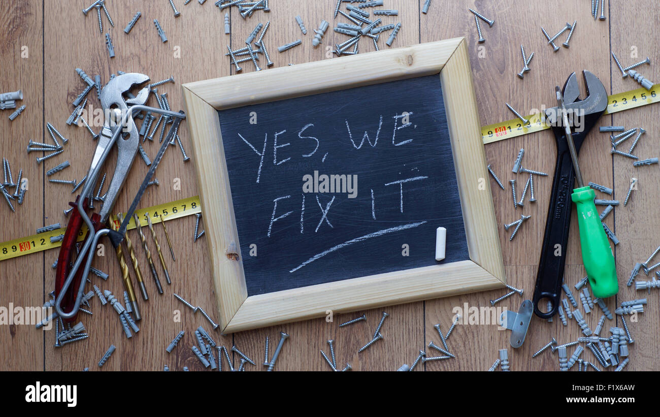 Yes, we can fix it written on a chalkboard next to tools, screws and ...