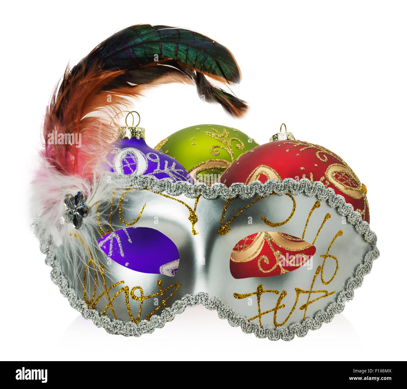 Christmas balls and carnival mask on the white background Stock Photo ...