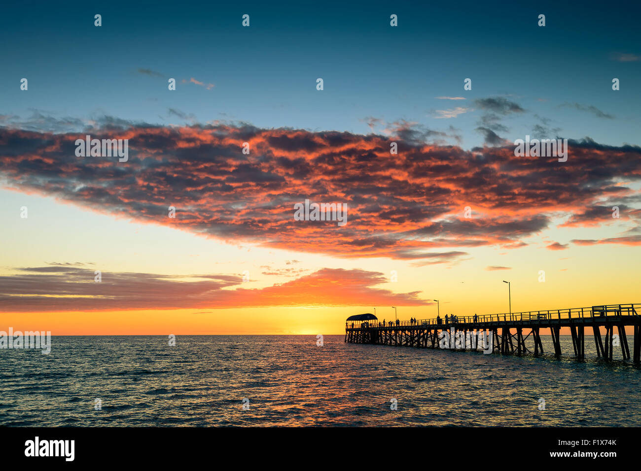 People are walking on the Henley Beach Jetty at sunset Stock Photo - Alamy