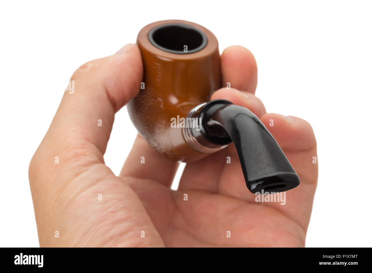 Tobacco pipe in hand isolated on white background Stock Photo - Alamy