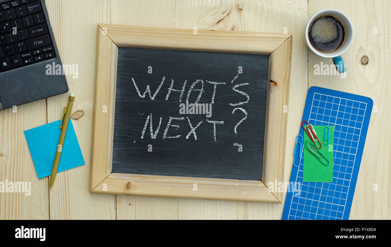 What's next? written on a chalkboard at the office Stock Photo - Alamy
