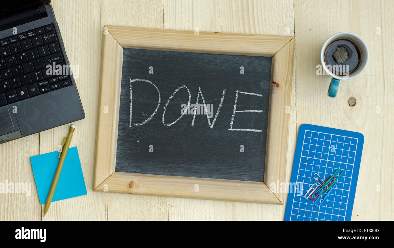 Done written on a chalkboard at the office Stock Photo - Alamy