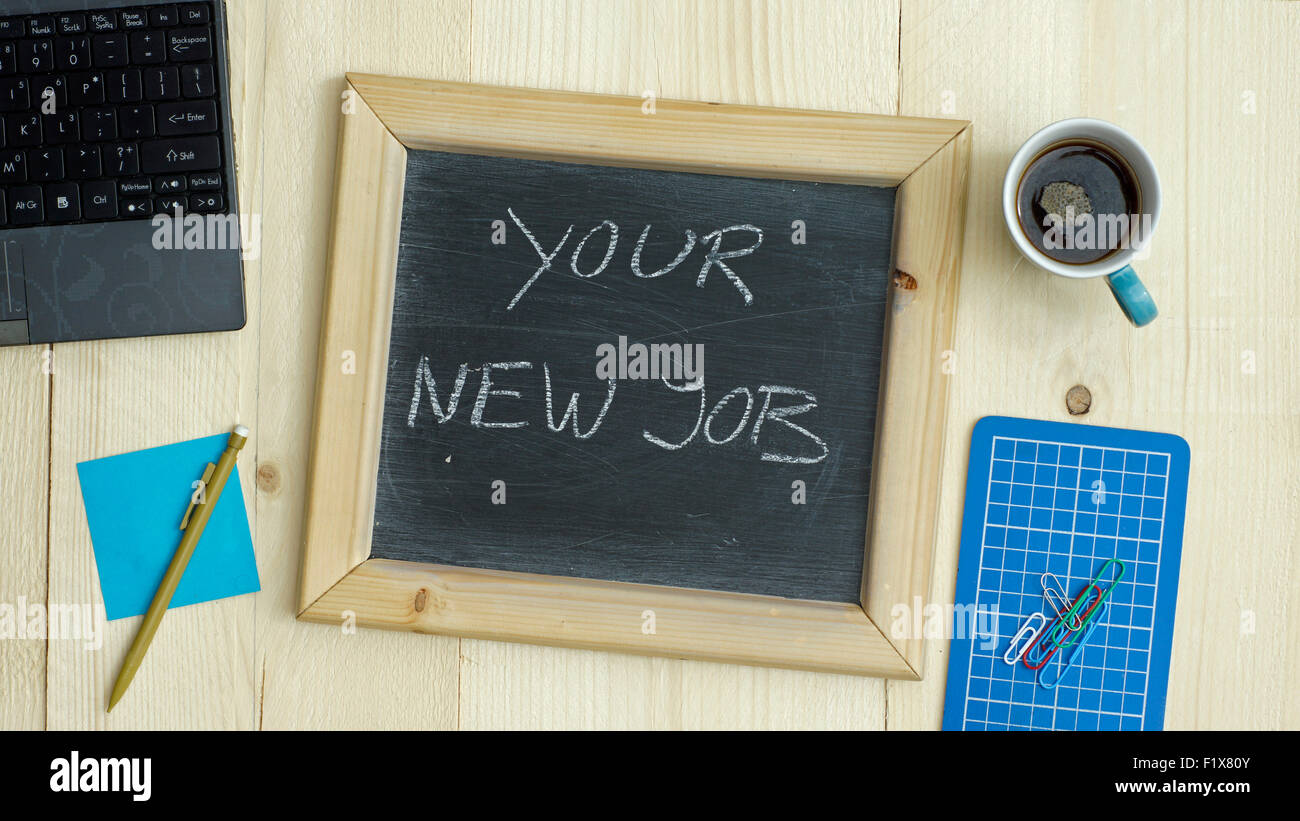 Your new job written on a chalkboard at the office Stock Photo - Alamy
