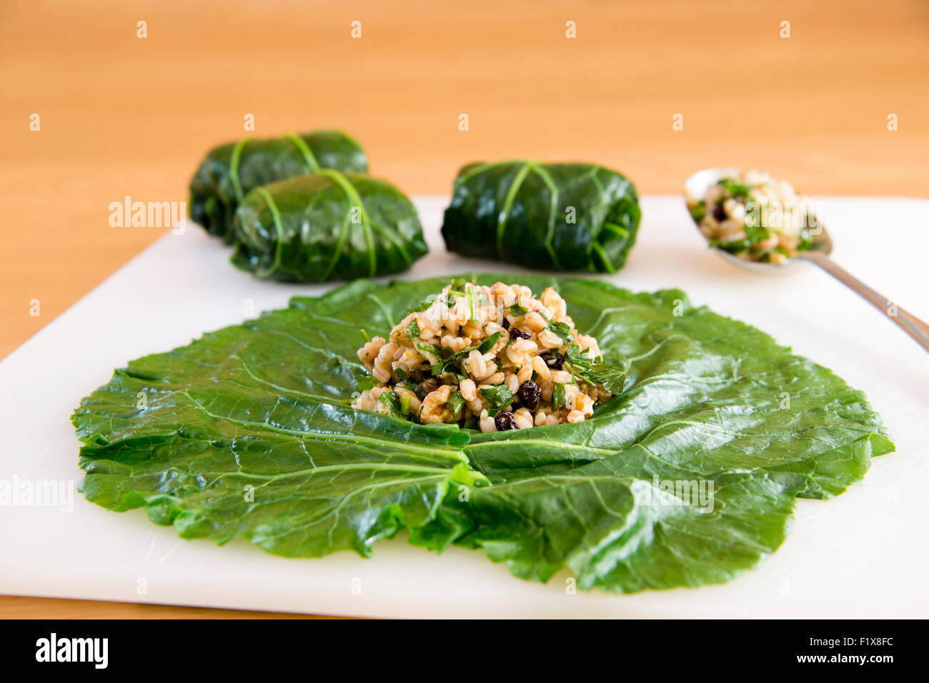 Stuffed cabbage leaves - adding a cooked filling to a blanched cabbage ...