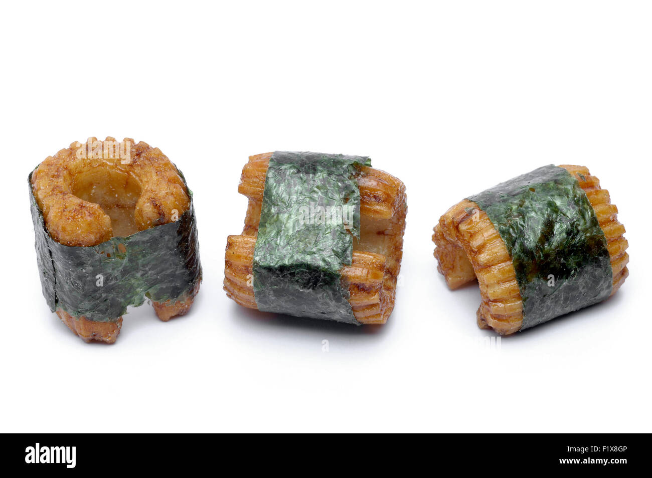 Sushi-shaped, small pastry pieces, wrapped with seaweed, seaweed, and a ...