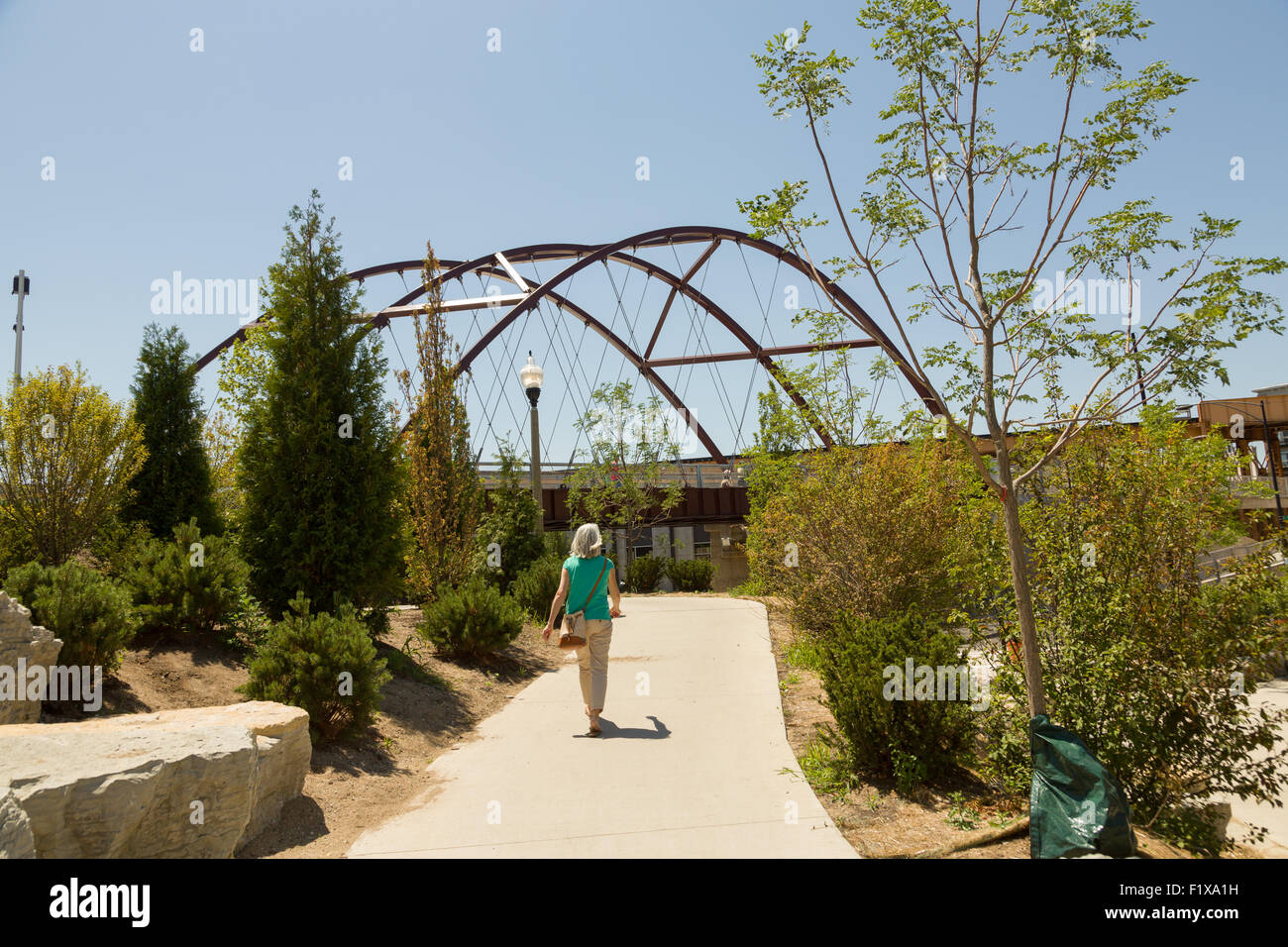 A pedestrian walks toward the Milwaukee Avenue bridge on the 606 ...