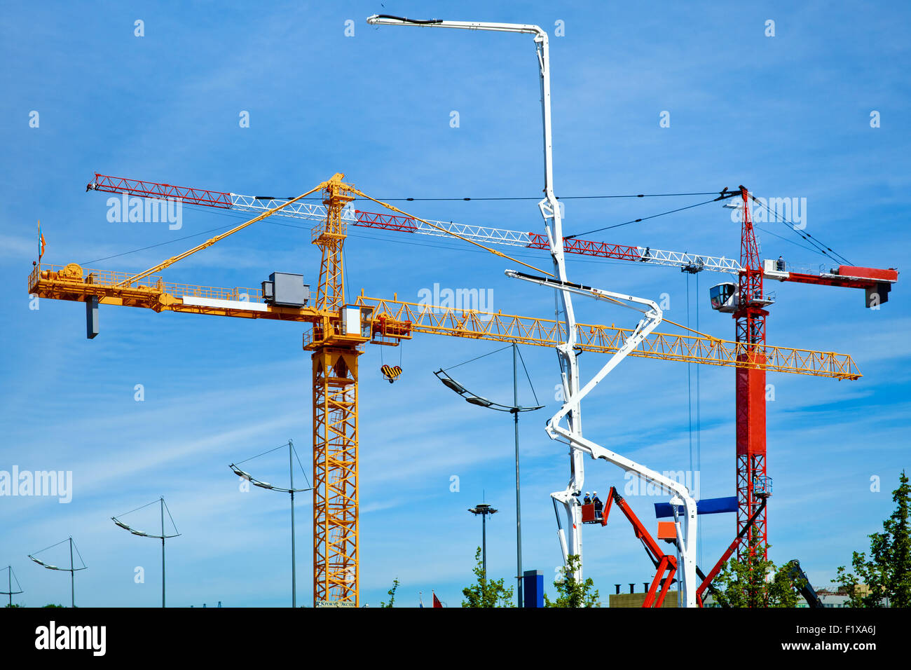 Different cranes on the construction site Stock Photo - Alamy
