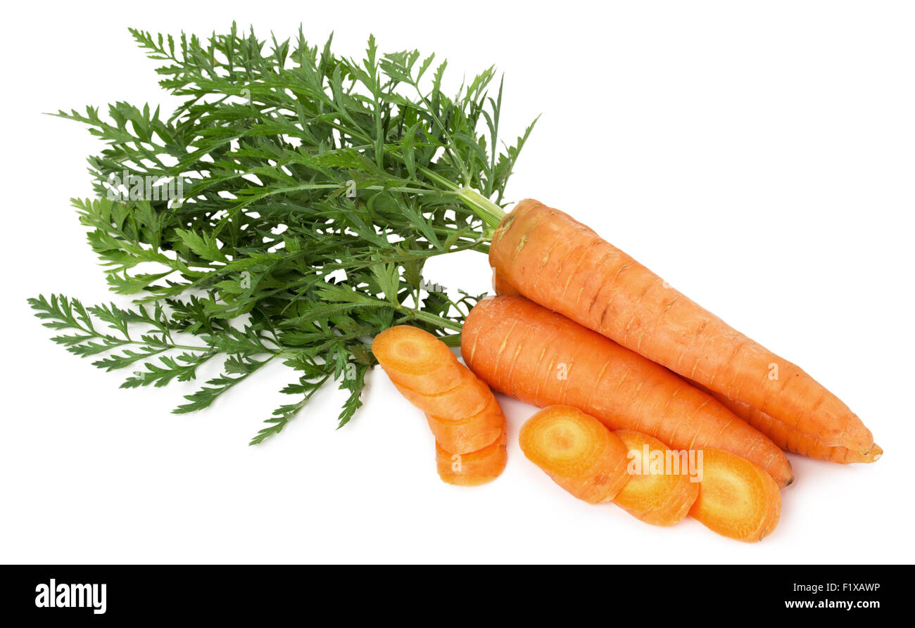 ripe carrot with sliches on the white background Stock Photo - Alamy
