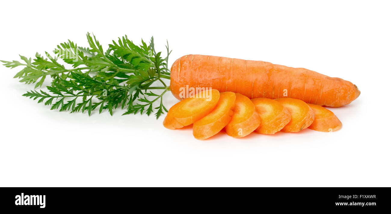 fresh carrot green on the white background Stock Photo - Alamy