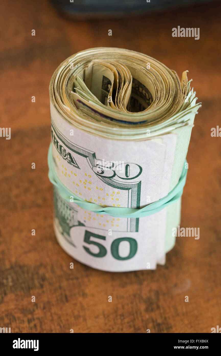 Money roll hi-res stock photography and images - Alamy