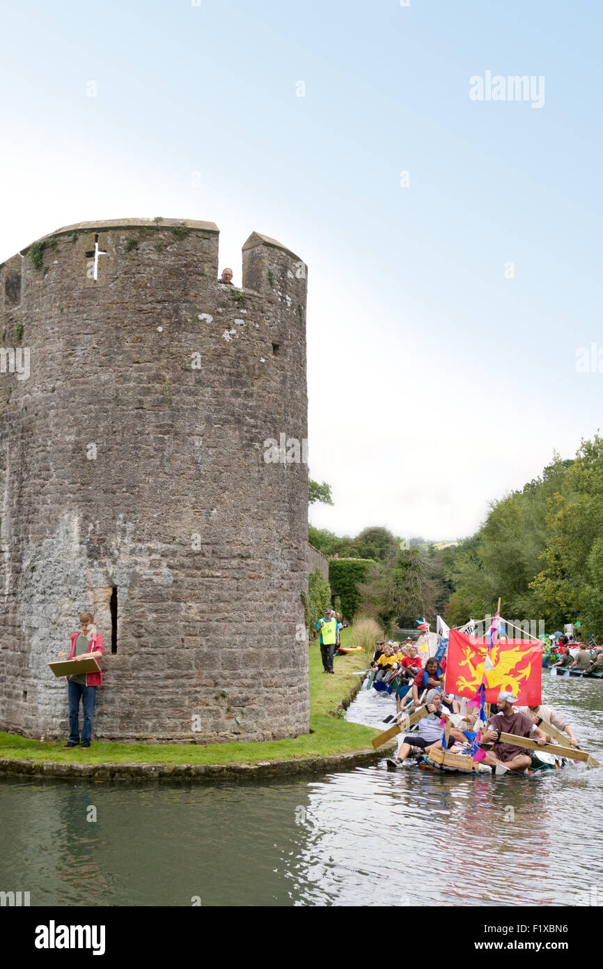 people and home made boats competing in the Wells Moat Boat race, an ...