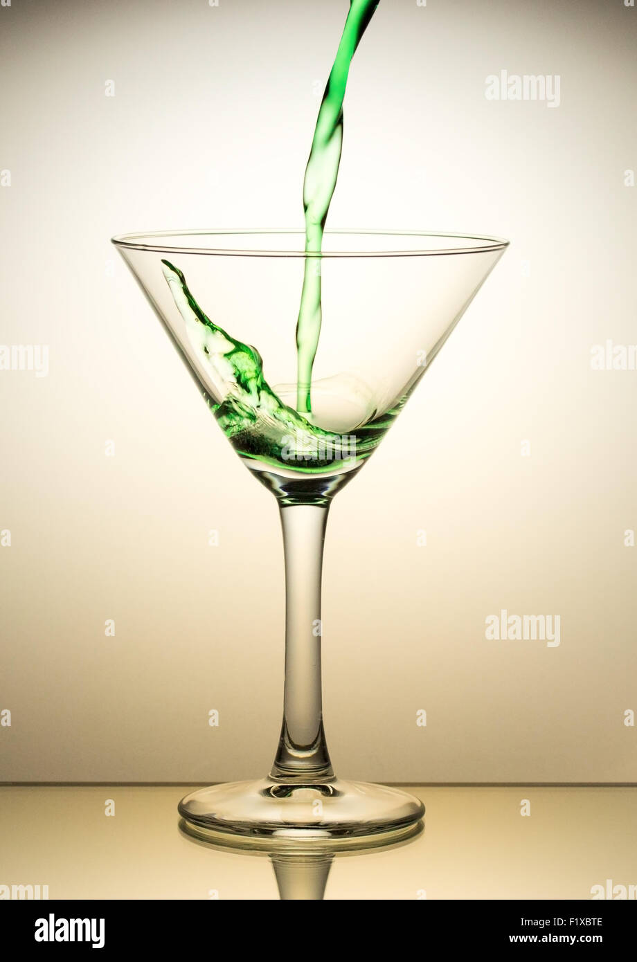 Green cocktail pouring Stock Photo - Alamy