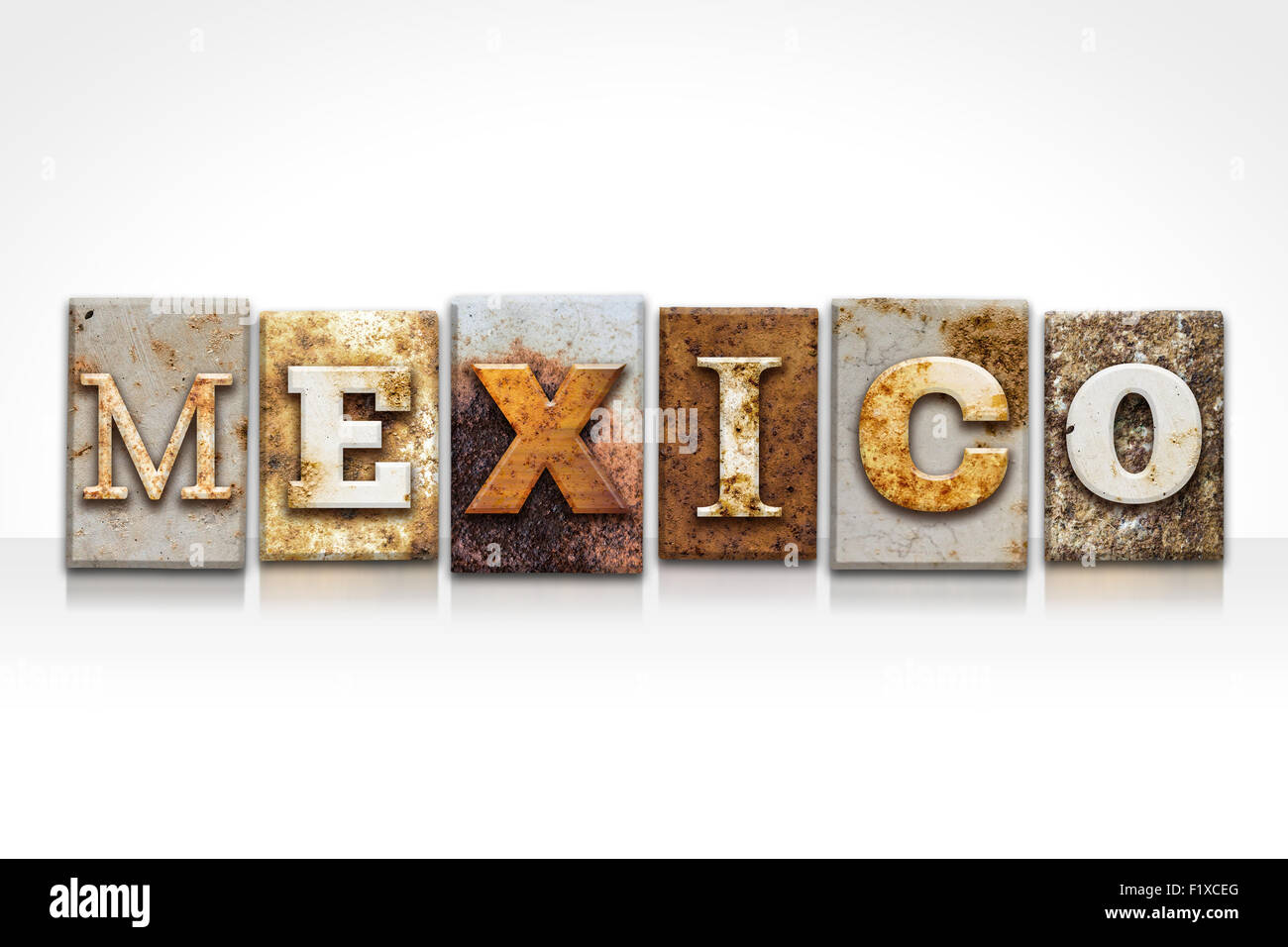 The word "MEXICO" written in rusty metal letterpress type isolated on a ...