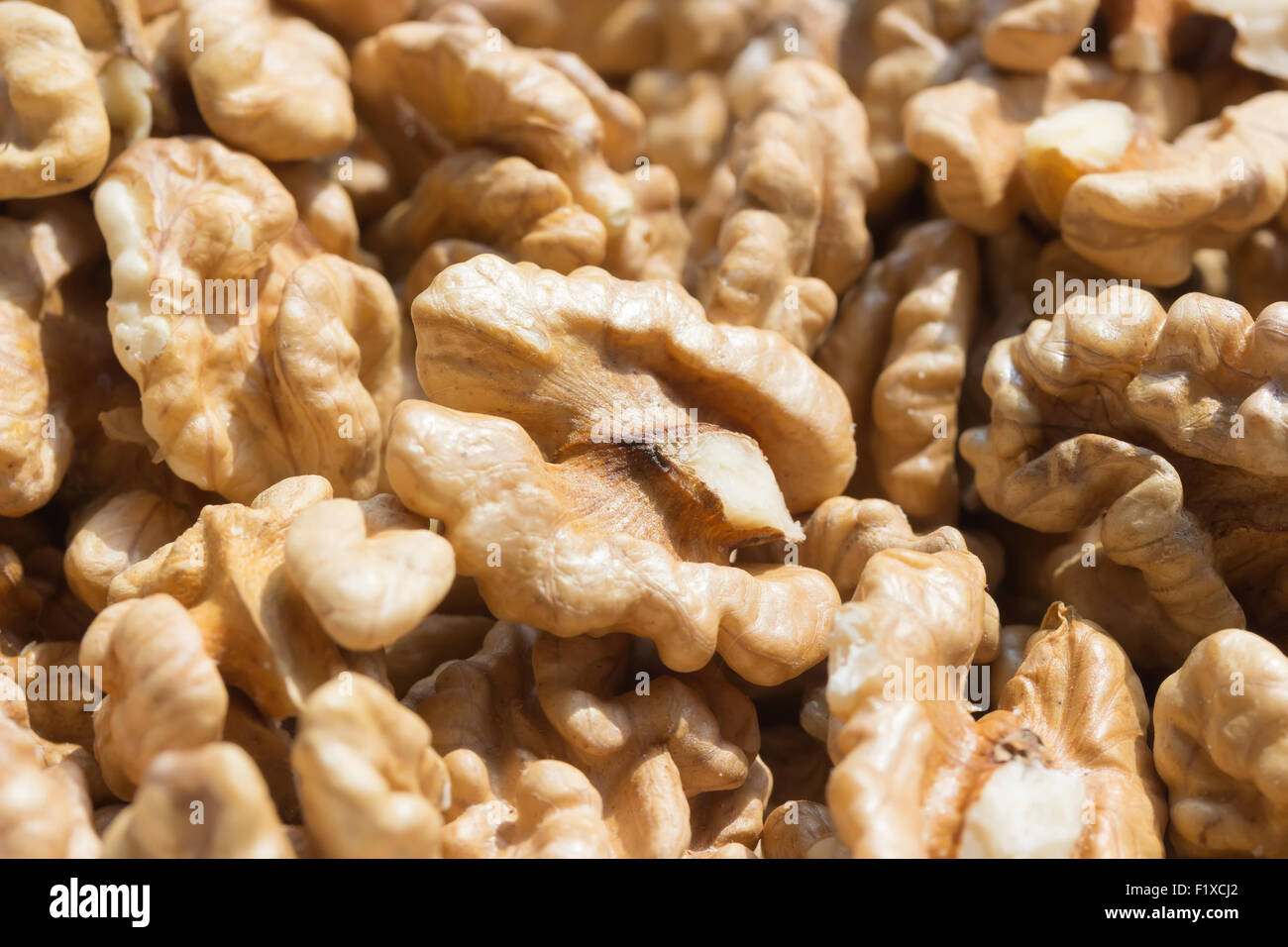 Walnut kernel like a background Stock Photo - Alamy