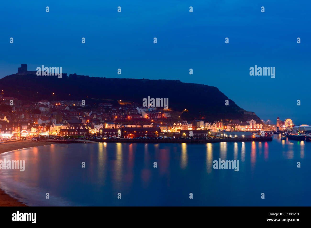 Scarborough harbour and castle, at night. In Scarborough, England Stock ...