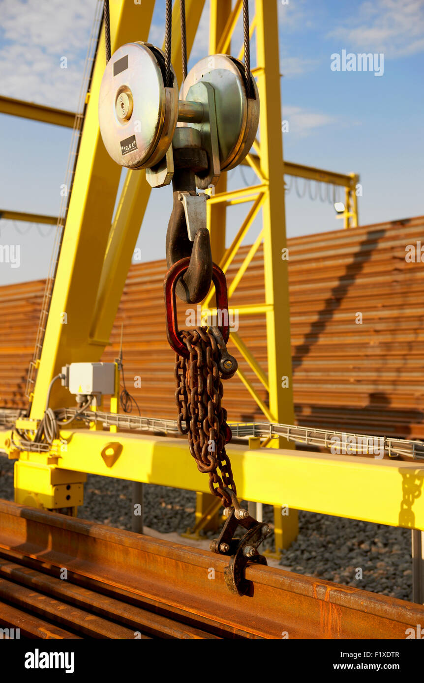 Railway assembly with crane and chain Stock Photo - Alamy