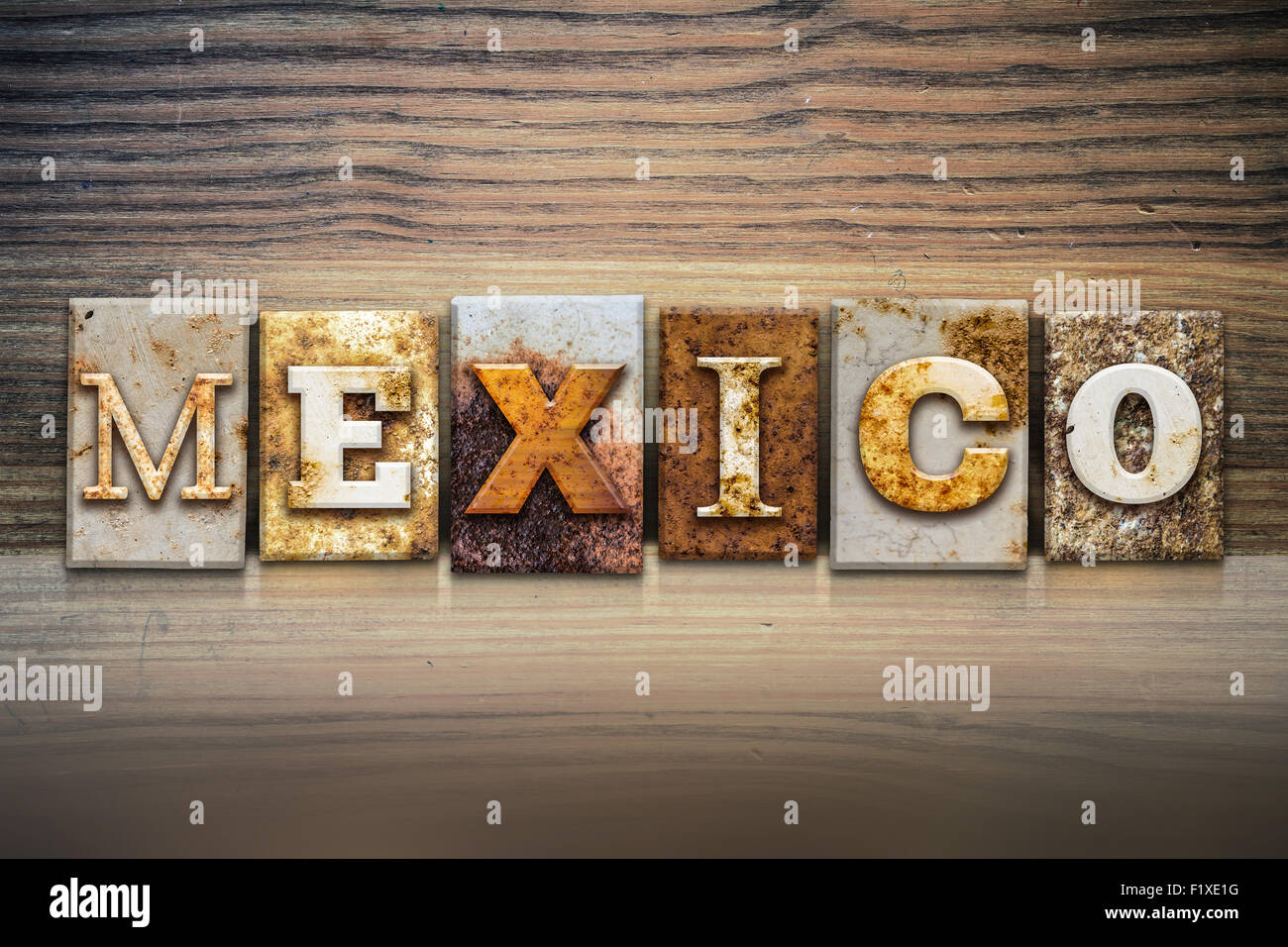The word "MEXICO" written in rusty metal letterpress type sitting on a ...