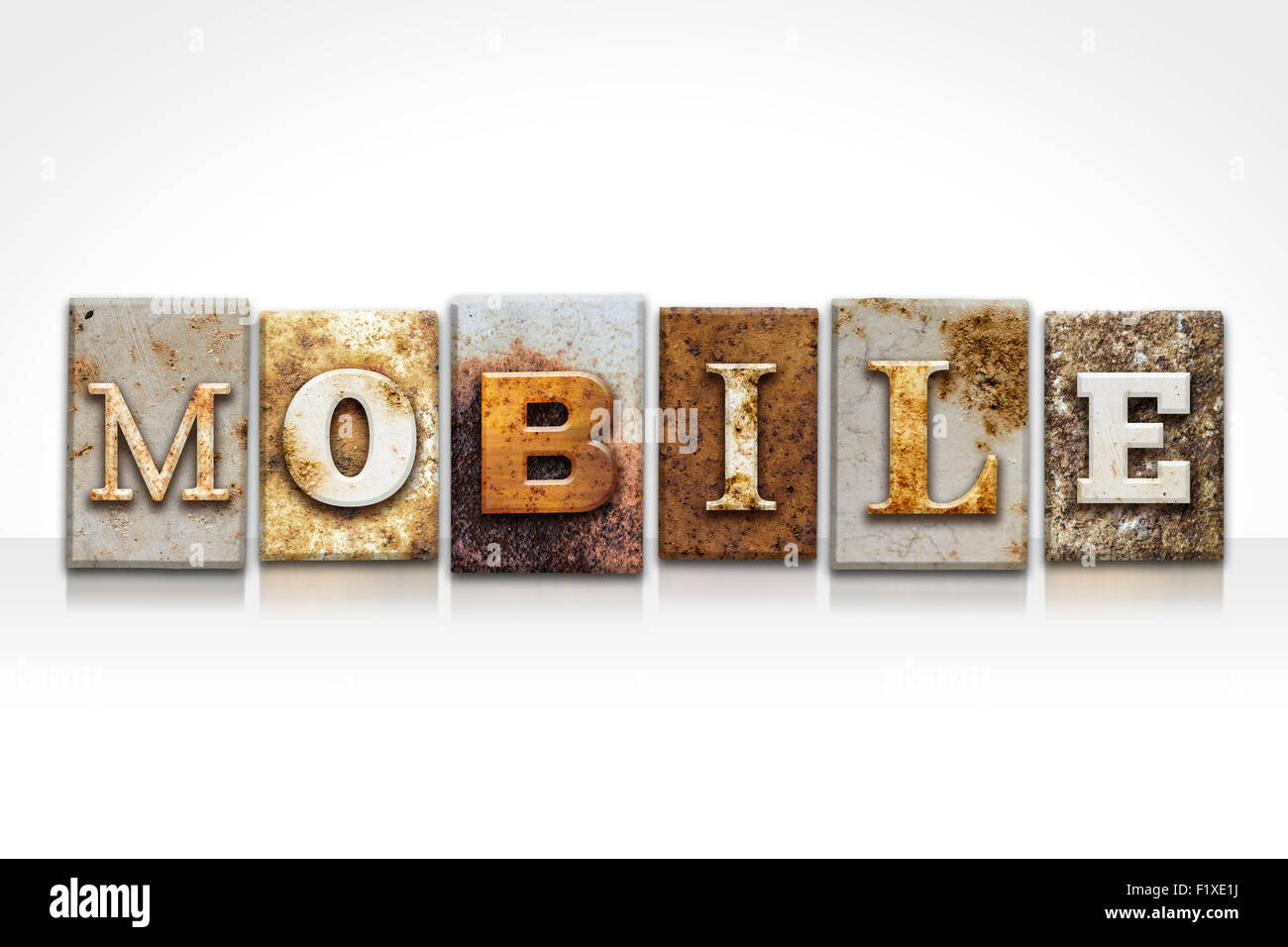 The word "MOBILE" written in rusty metal letterpress type isolated on a ...