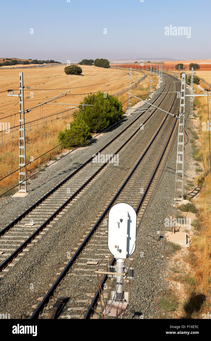 Rail road across spanish country side vertical Stock Photo - Alamy