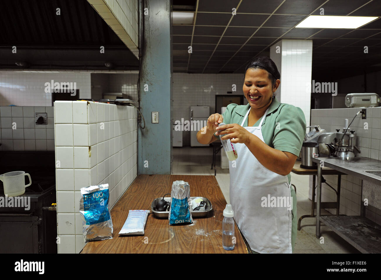 Guatemala, Salama, nurse preparing F100 formula with complementary food ...
