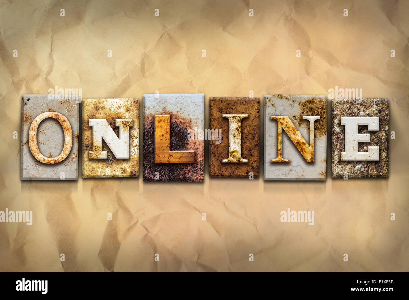 The word "ONLINE" written in rusty metal letterpress type on a crumbled ...