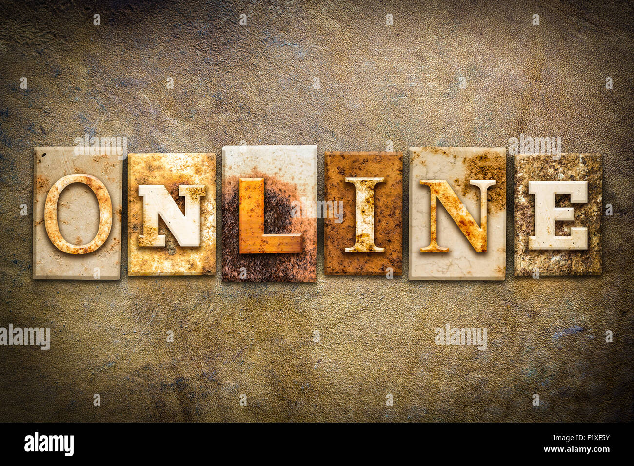 The word "ONLINE" written in rusty metal letterpress type on an old ...